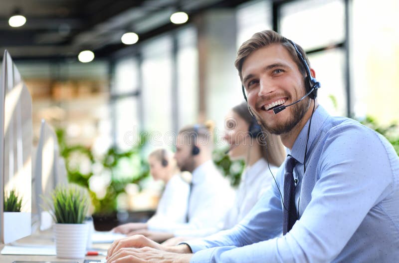Portrait of Call Center Worker Accompanied by His Team. Smiling ...