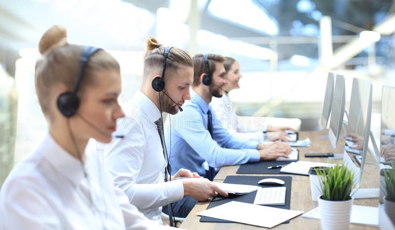 Portrait of Call Center Worker Accompanied by His Team. Smiling ...