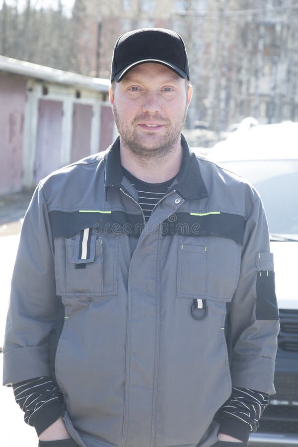 Portrait of a Car Mechanic on the Street.an Auto Mechanic in a Work ...