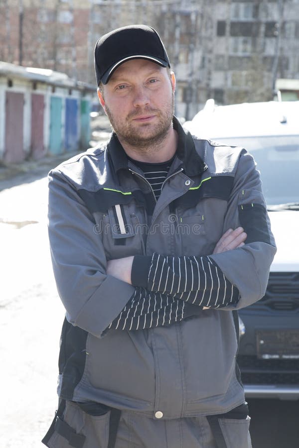 Portrait of a Car Mechanic on the Street.an Auto Mechanic in a Work ...