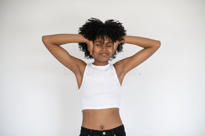 Portrait Of Carefree African American Woman With Hands At Head Stock