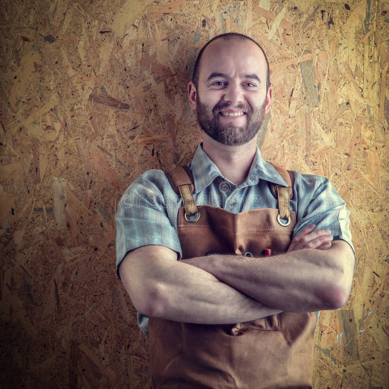 Portrait of a Carpenter Inside His Carpentry Workshop Using a Band Saw ...