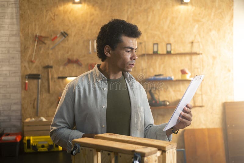 Portrait of a Carpenter Holding and Looking at Notes Stock Image ...