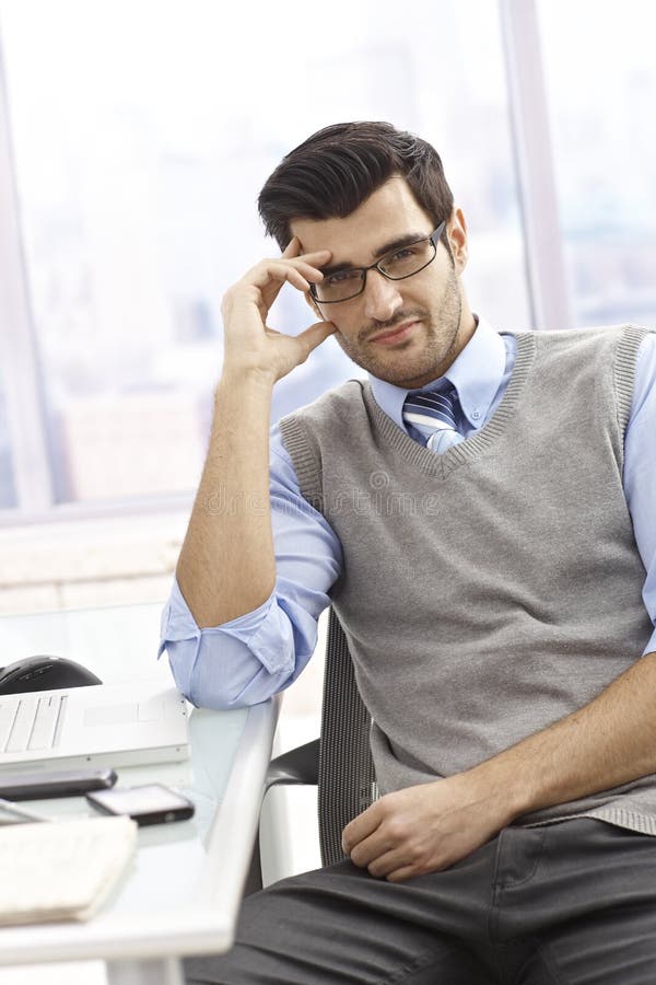 Portrait of Casual Office Worker Sitting at Desk Stock Photo - Image of ...