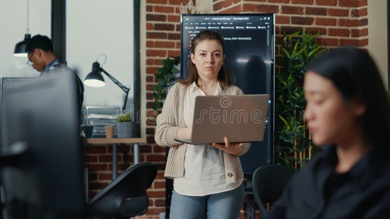 Portrait of Caucasian App Developer Holding Laptop Looking Up and Smiling Stock Photo - Image of ...