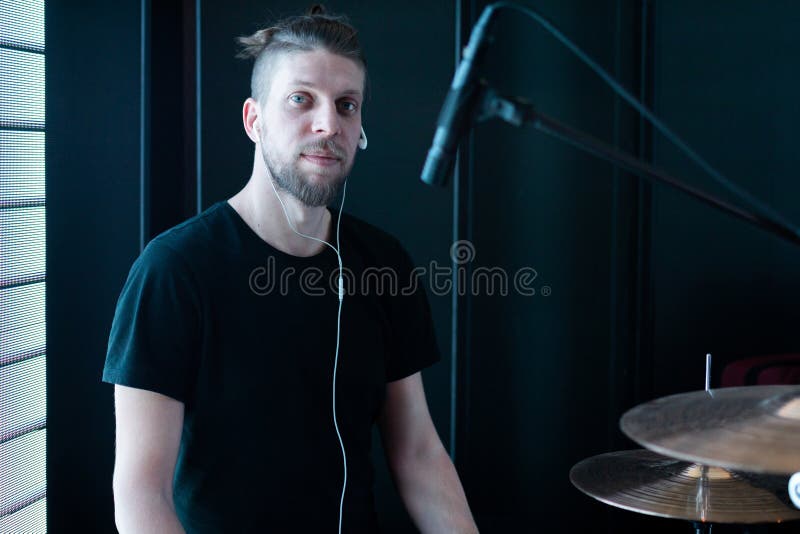 Portrait of a Caucasian Bearded Drummer on a Black Stage Behind a Drum ...