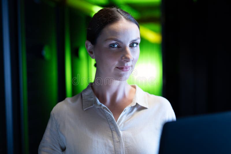 Portrait of Caucasian Female Engineer with Laptop in Computer Server ...