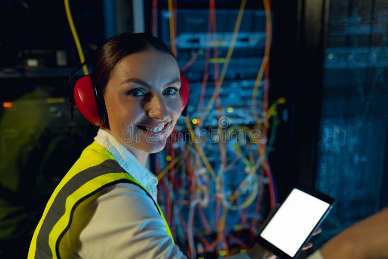 Portrait of Caucasian Female Engineer Smiling while Using Digital ...