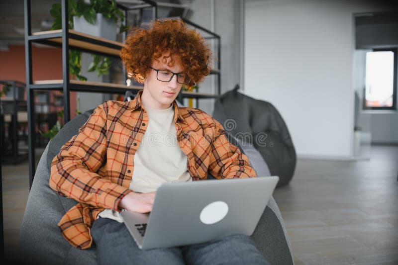 Portrait of Caucasian Male Freelancer in Trendy Apparel Sitting at ...