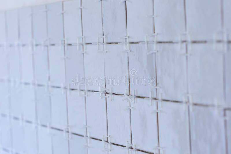 A Portrait of a Ceramic Tile Wall Under Construction. the Wall is Being ...