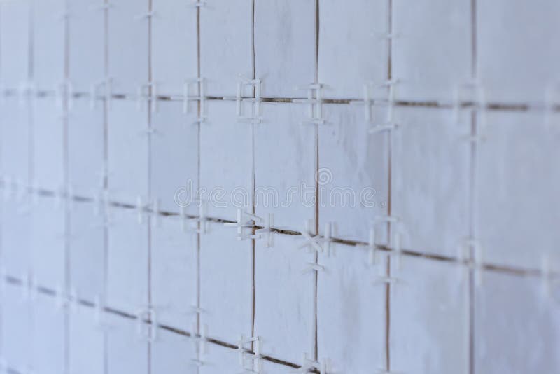A Portrait of a Ceramic Tile Wall Under Construction. the Wall is Being ...