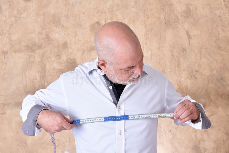 Portrait of Charming Man Taking Measurements in White Shirt with Gray ...