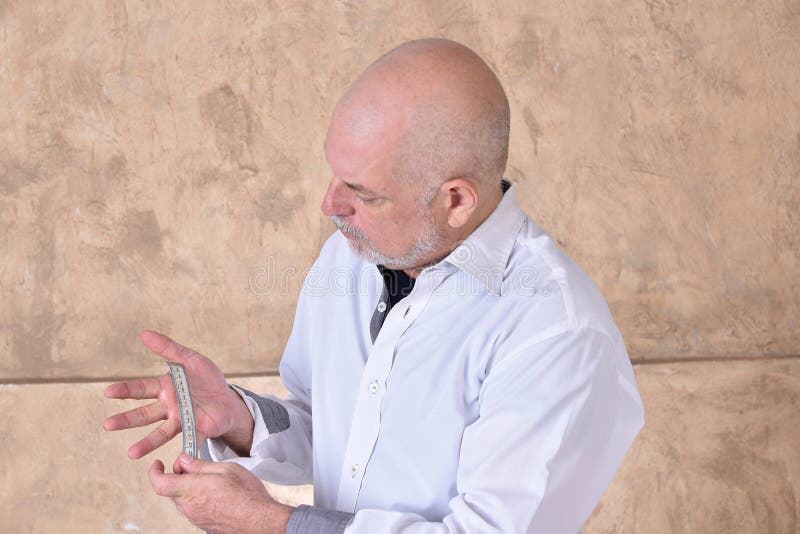 Portrait of Charming Man Taking Measurements in White Shirt with Gray ...