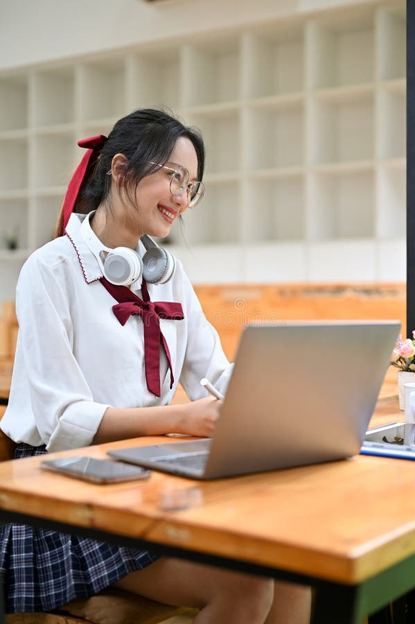 Charming Young Asian Female High School Student in Uniform Doing Her ...
