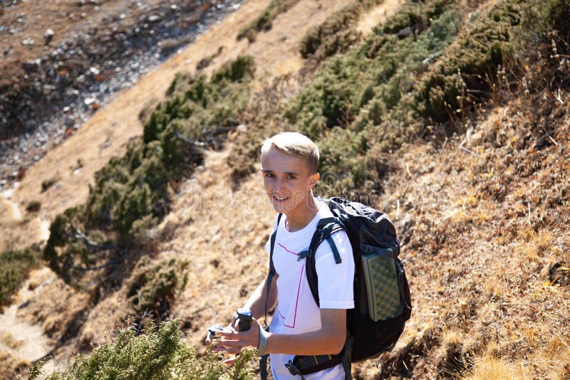 Portrait of a Cheerful Blond Young Man Wearing a Backpack Stock Image ...