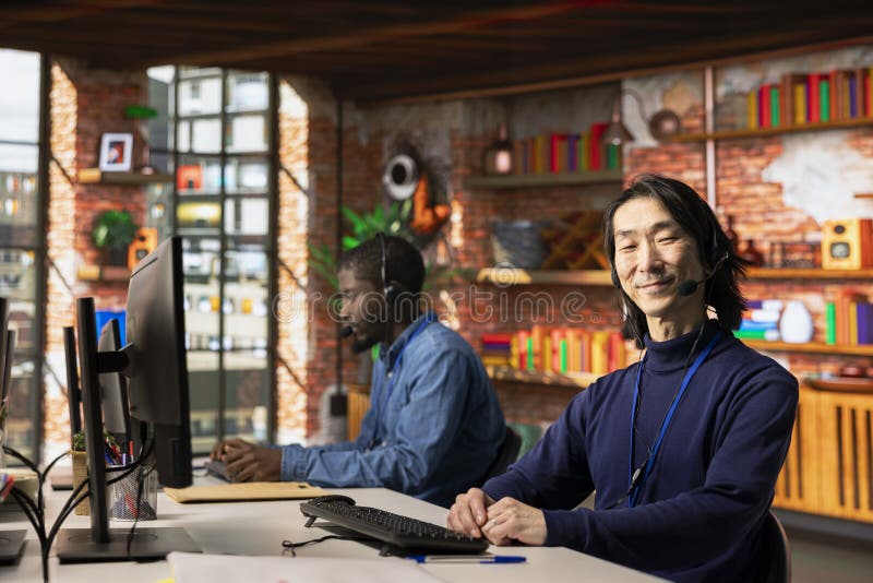 Portrait of Cheerful Call Center Agent Using Remote Access Tools on ...