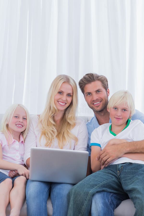 Portrait of a Cheerful Family Using a Laptop Stock Photo - Image of ...