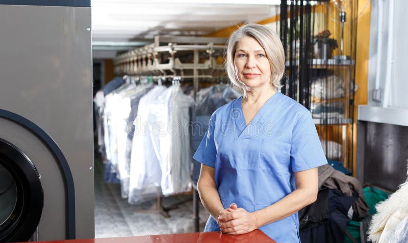 Portrait of Cheerful Female Laundry Worker Stock Image - Image of ...