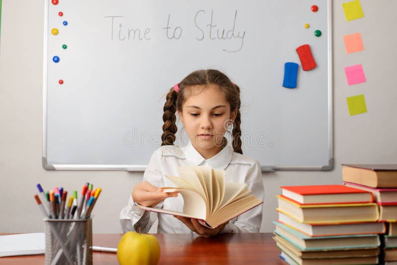Portrait of Cheerful Girl School Learner Looking through the Book ...