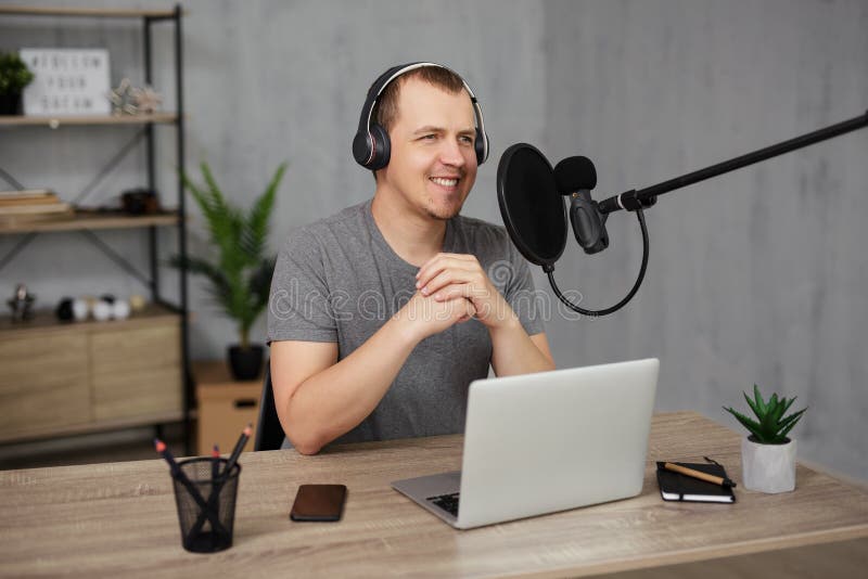 Portrait of Cheerful Handsome Guy Streaming His Audio Podcast Using ...