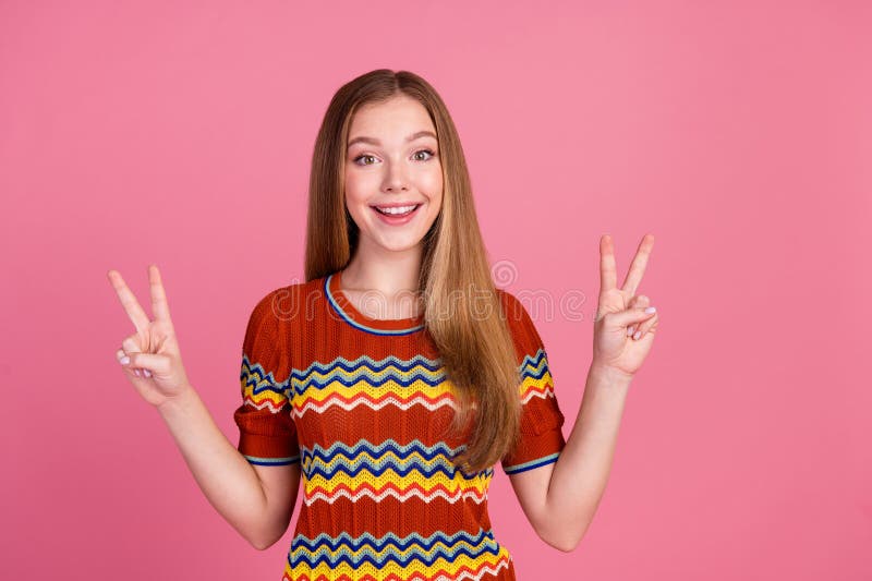 Portrait Of Cheerful Lovely Girl Toothy Smile Demonstrate V Sign Empty