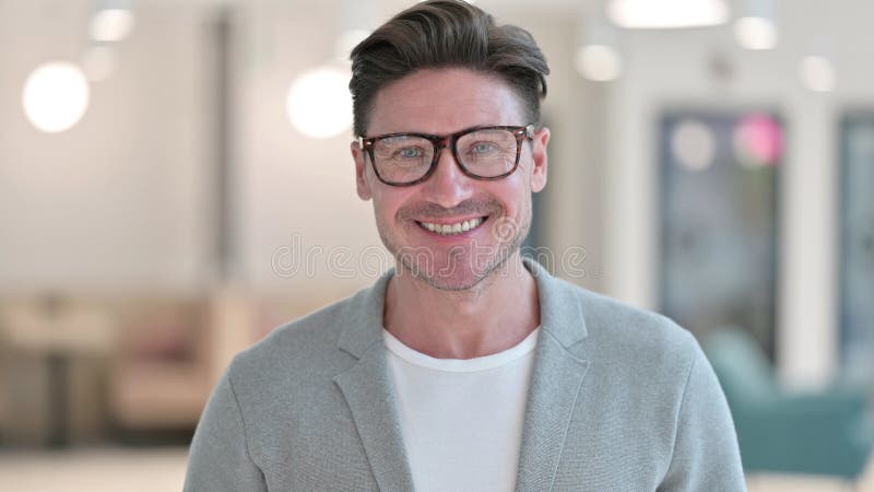 Portrait of Cheerful Middle Aged Man Smiling at Camera Stock Photo ...