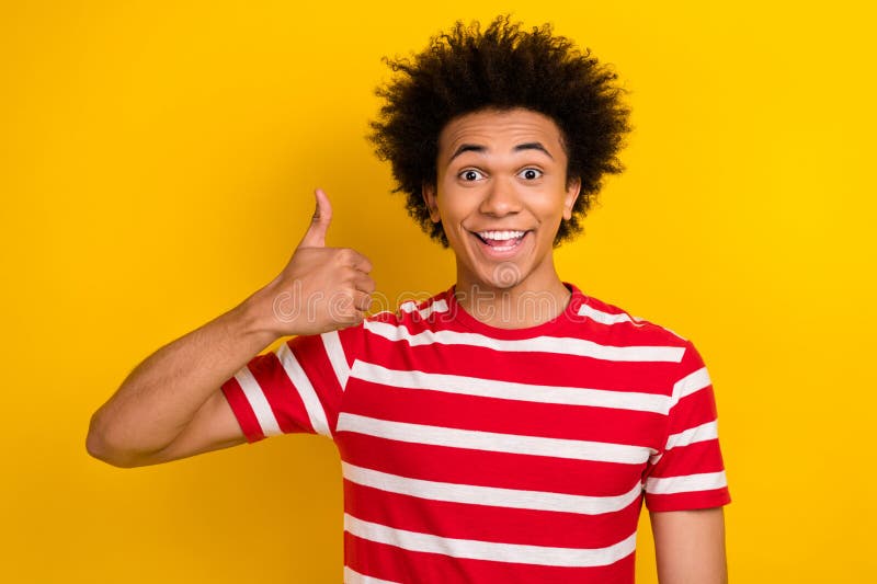 Portrait Of Cheerful Person Toothy Smile Demonstrate Thumb Up Approve