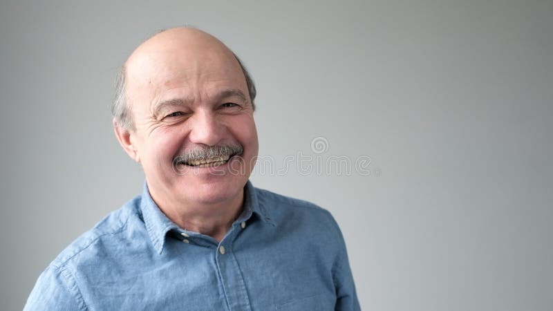 Cheerful Senior Man Who is Looking at Camera and Smiling. Stock Image ...