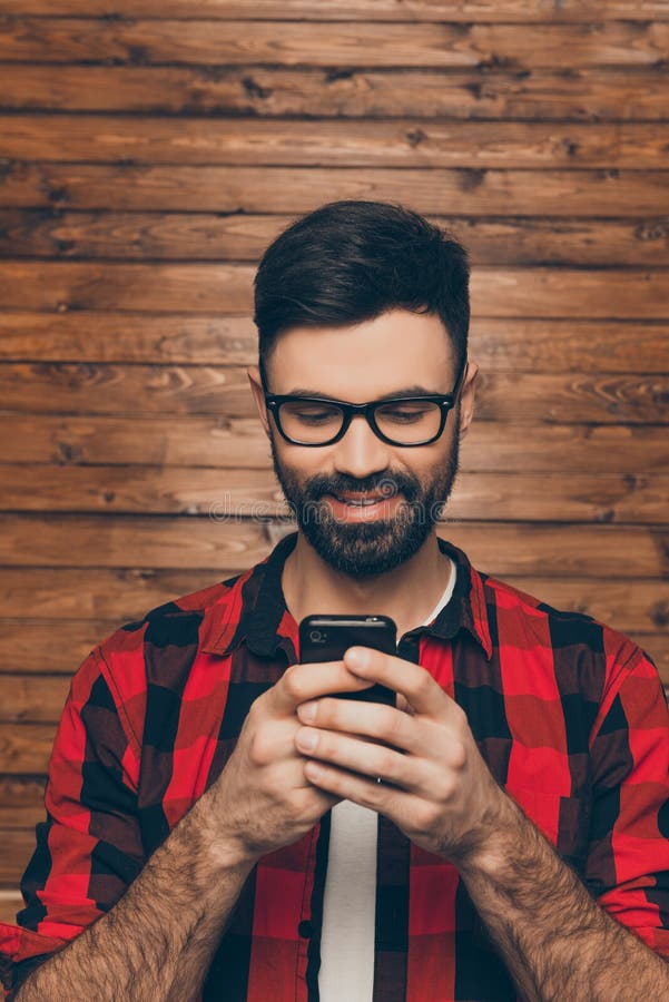 Portrait of Cheerful Smiling Young Man Chatting on Smartphone Stock ...