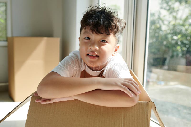 Boy Sitting Inside Cardboard Box Stock Photo - Image of asian, play ...