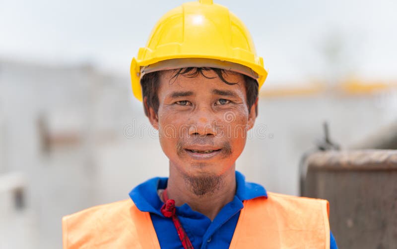 Cheerful Man Worker Displaying Various Motorcycles in Workshop Stock ...