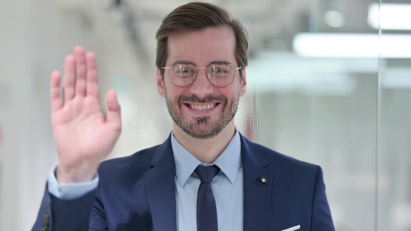 Portrait of Cheerful Young Businessman Waving at the Camera Stock Image ...