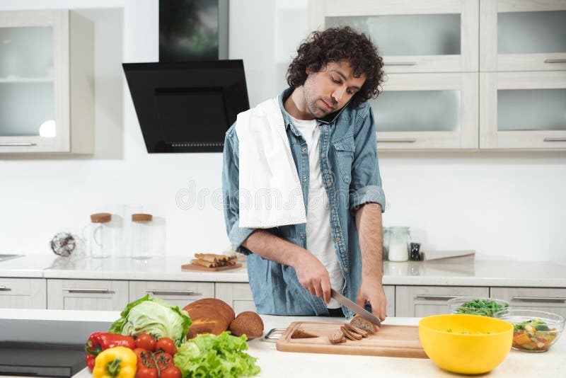 Busy Guy Cooking Lunch at Home Stock Photo - Image of desk, lifestyle ...