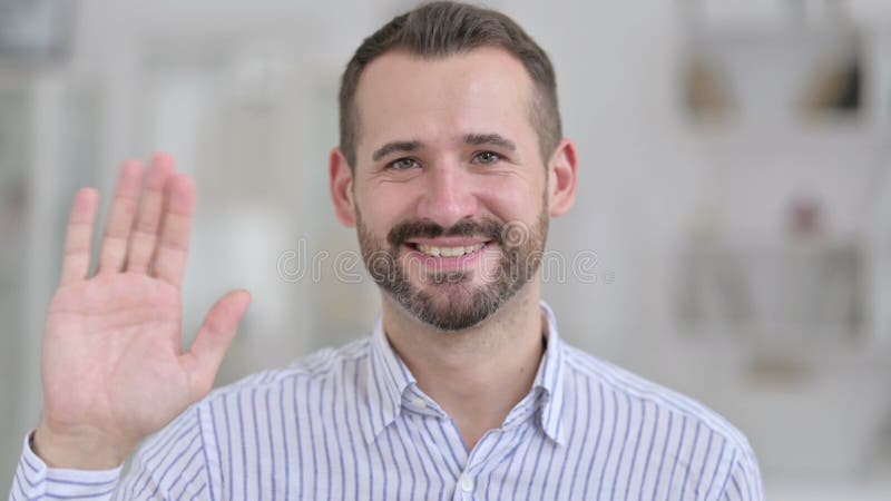 Portrait of Cheerful Young Man Waving, Hello Stock Video - Video of ...