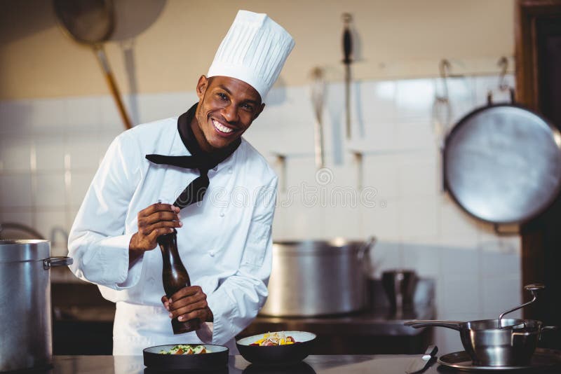 Portrait of Chef Sprinkling Pepper on a Meal Stock Image - Image of ...