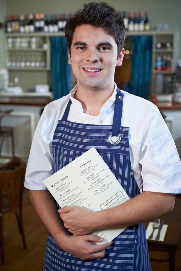 Portrait of Chef Standing in Restaurant Holding Menu Stock Image ...