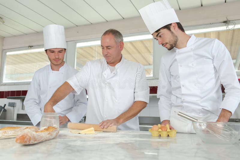 Portrait chefs at work stock photo. Image of person - 262492026
