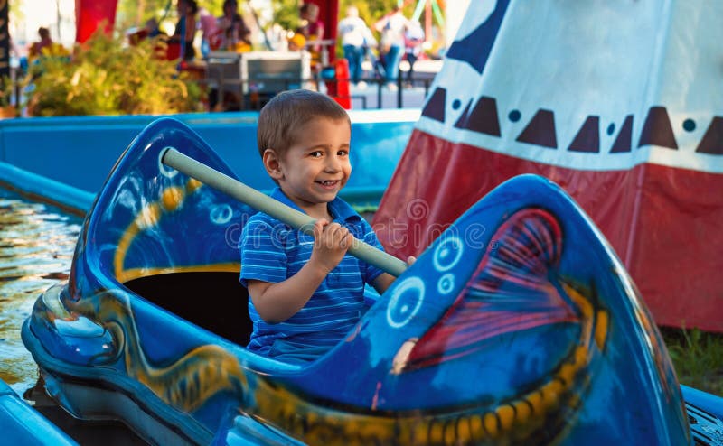 Portrait of a Child at an Amusement Park. Stock Image - Image of ...