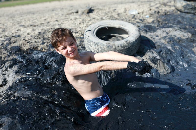 Child Standing in Pool of Healing Mud Stock Photo - Image of care ...