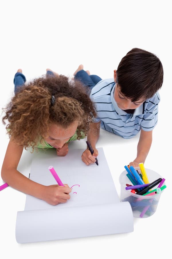 Portrait of Children Drawing while Lying on the Floor Stock Image ...