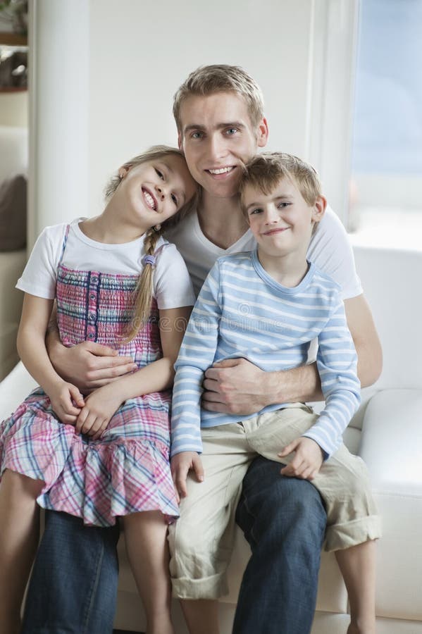 Portrait of Children Sitting on Father S Laps Stock Photo - Image of ...
