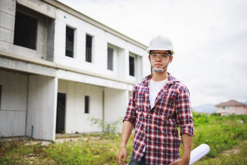 Portrait of Civil Engineer, Field Engineer, Foreman, Owner Standing in ...