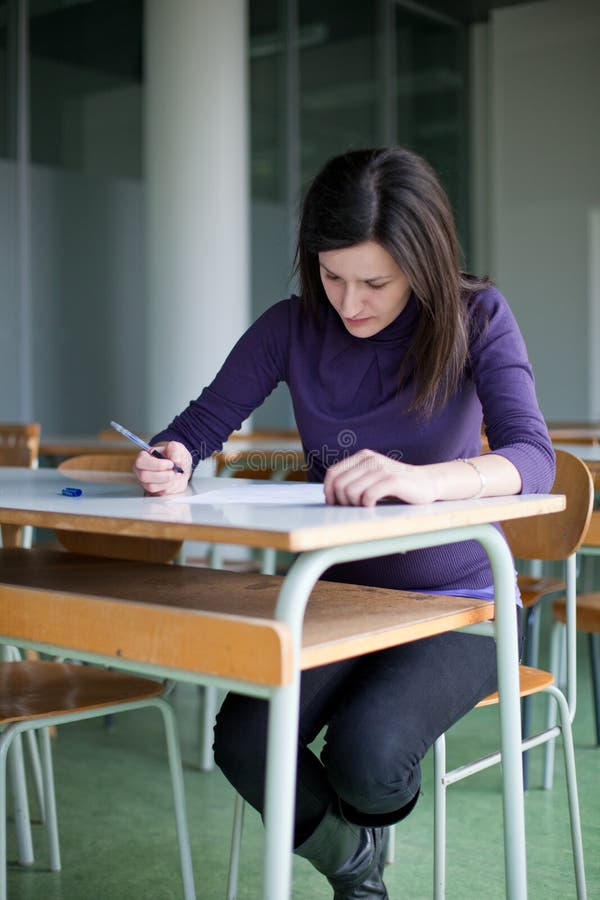 Portrait of College Student in a Classroom Stock Photo - Image of paper ...