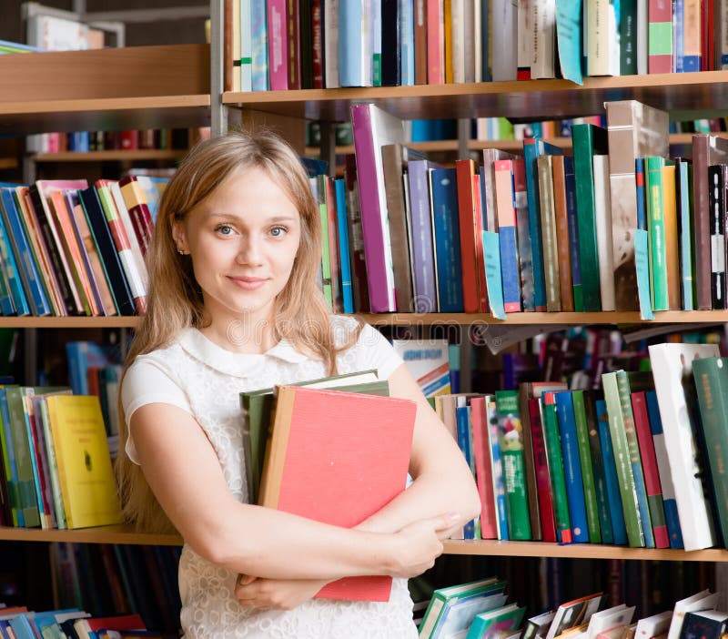 Portrait of a Pretty Female Student Studying in Library Stock Image ...