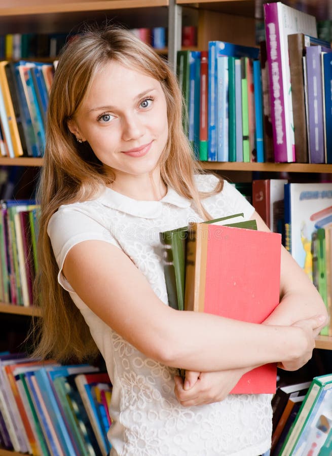 Portrait of a College Student in Library Stock Photo - Image of book ...