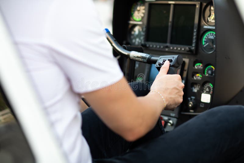 Portrait of Commercial Pilot in Uniform Sitting Inside Helicopter Cabin ...