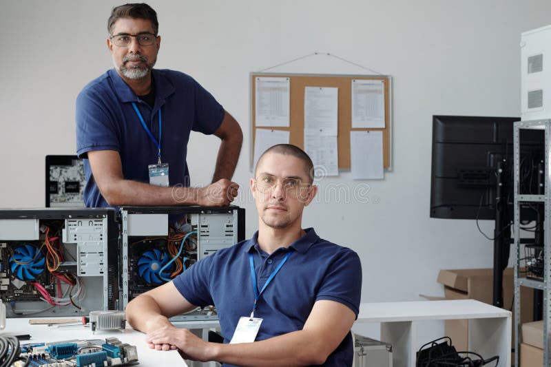 Portrait of Computer Technicians Examining Hardware Components Stock ...