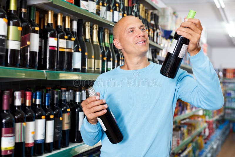 Man purchasing wine stock photo. Image of shopper, caucasian - 246624790