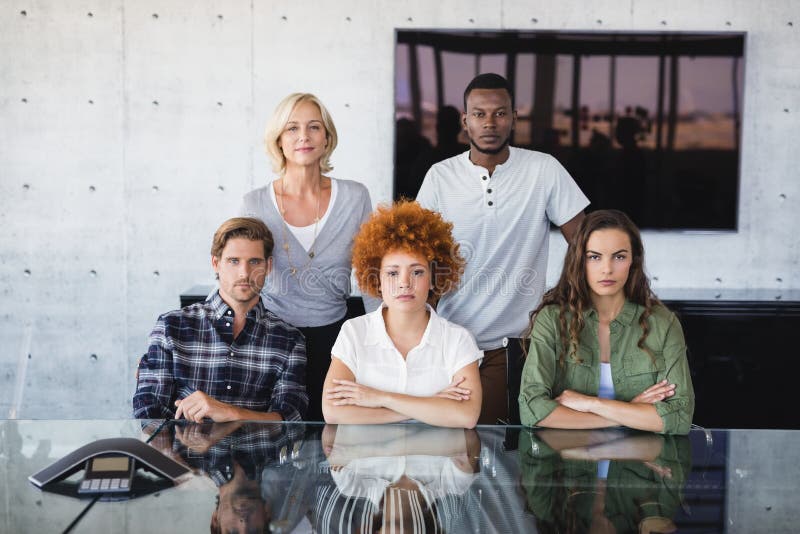 Portrait of Confident Colleagues at Desk Stock Image - Image of mature ...