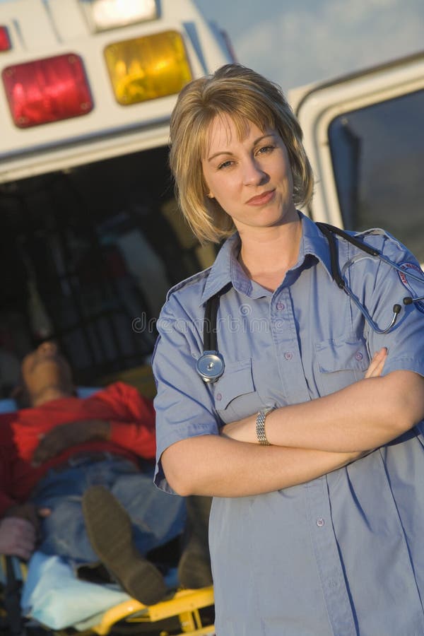 Firefighter and EMT Doctor Helping an Injured Woman Stock Photo - Image ...